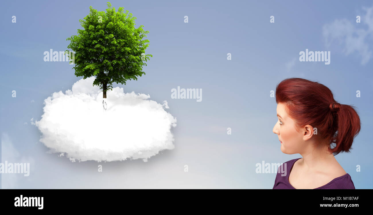 Young girl pointing at a green tree on top of a white cloud concept ...
