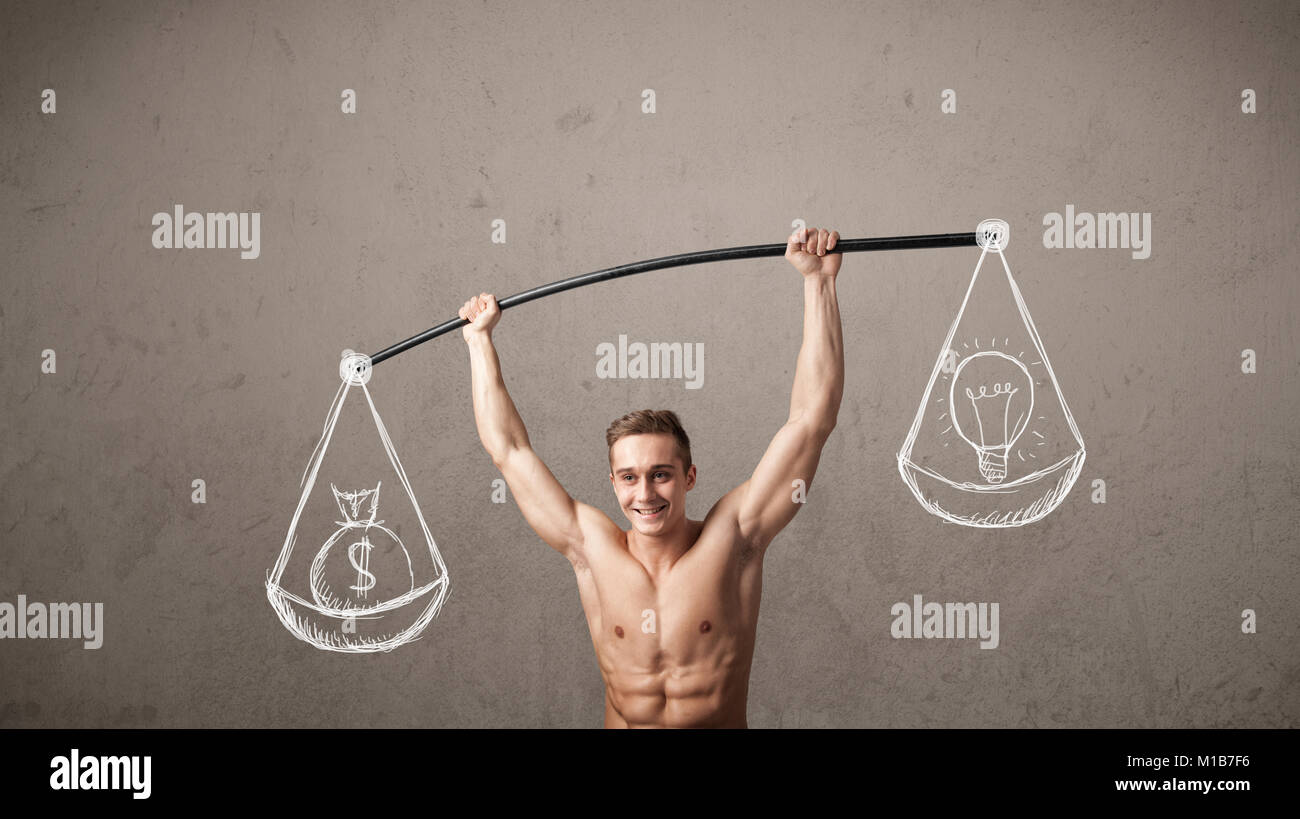 Strong muscular man trying to get balanced Stock Photo - Alamy