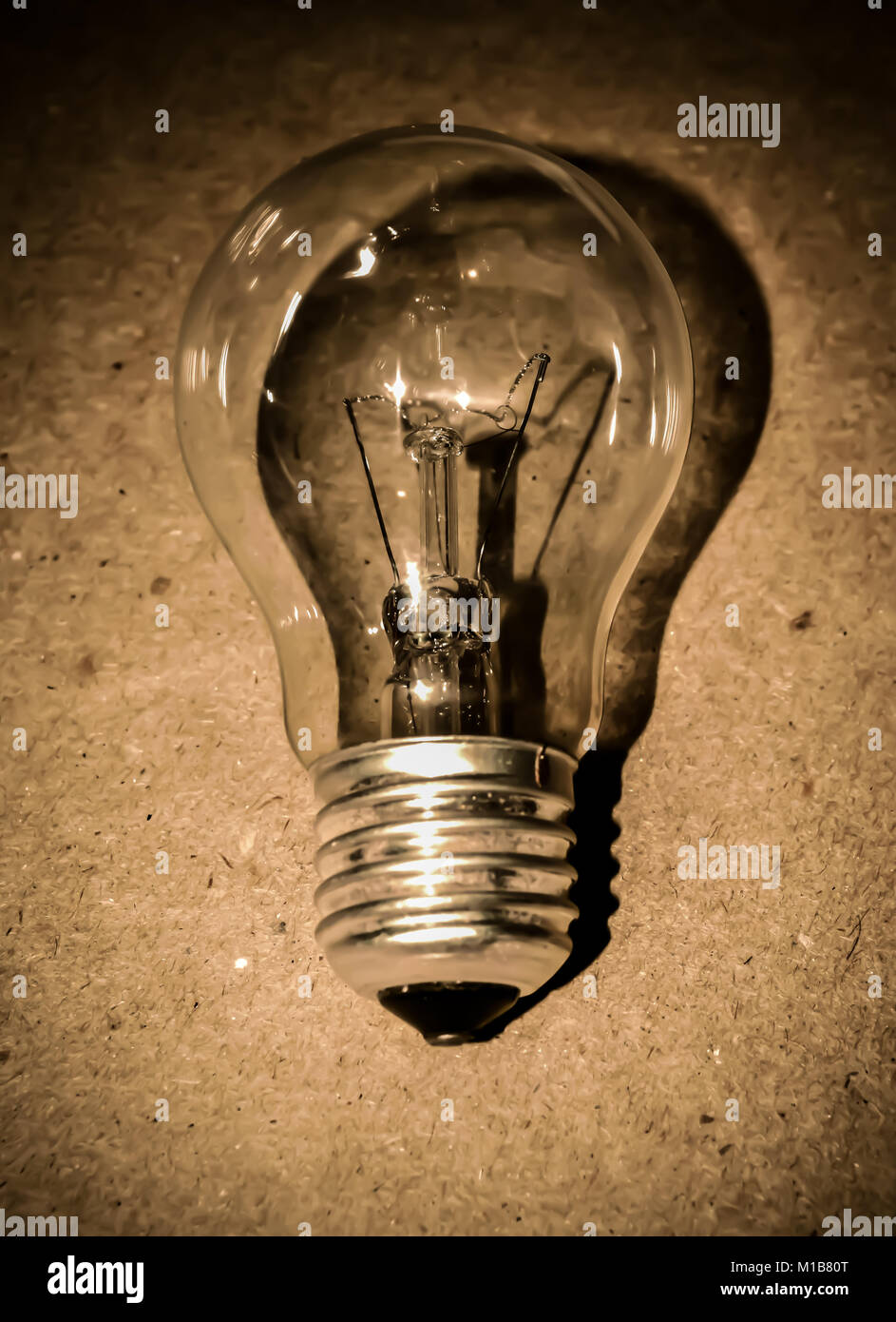isolated glowing old fashioned bulb. light bulb on a colored background ...