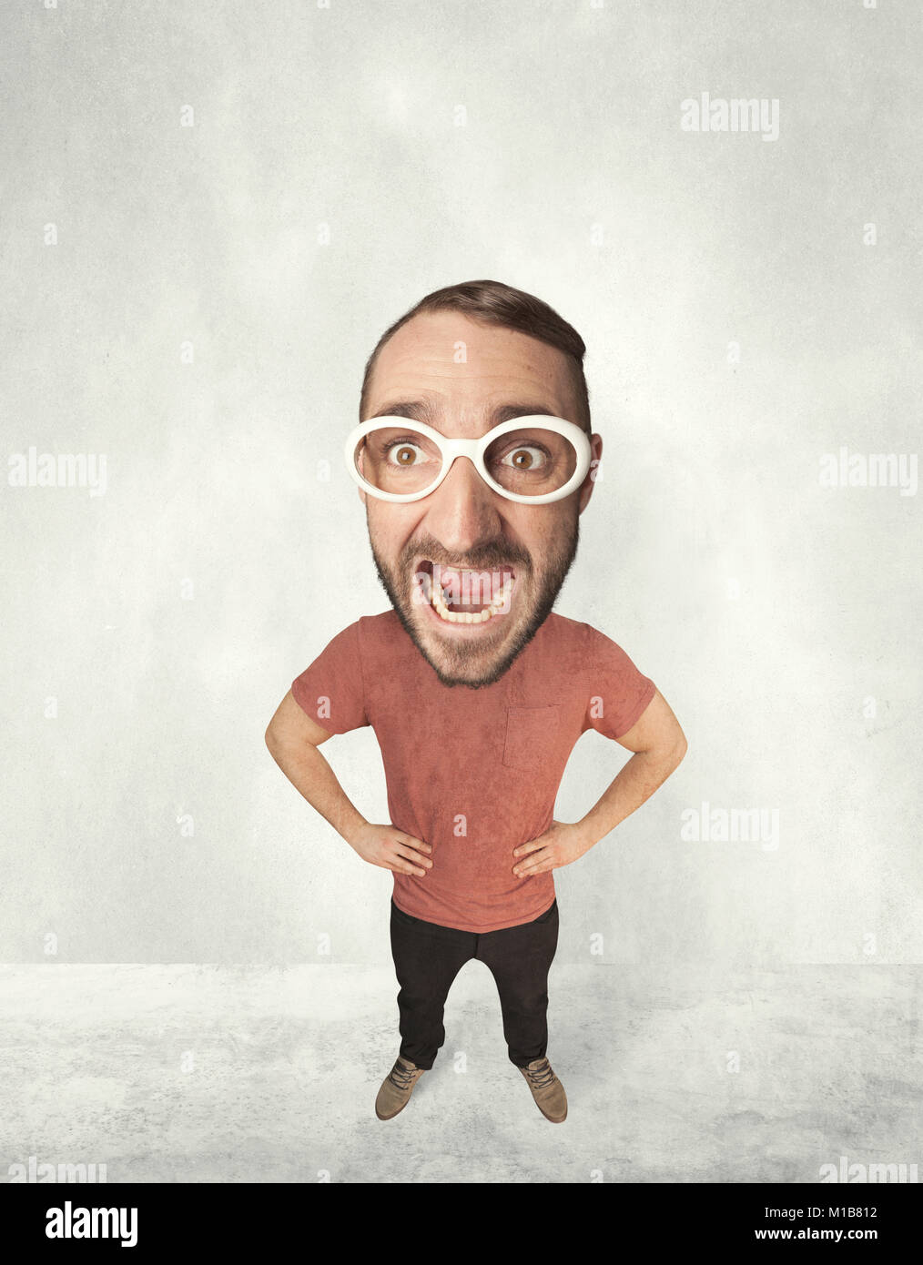 Funny person with big head makes jesting facial expression Stock Photo ...