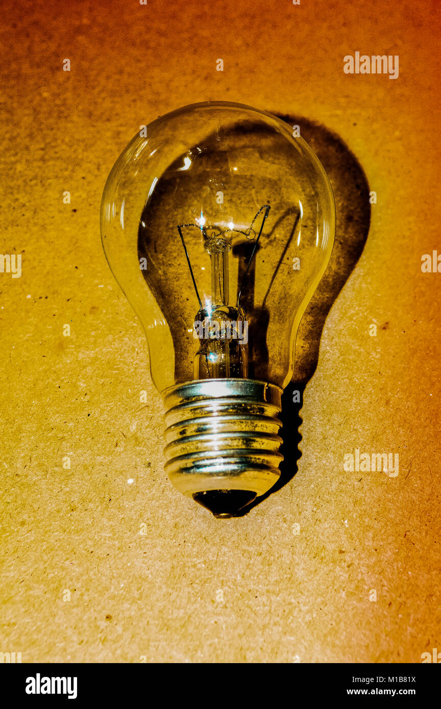 isolated glowing old fashioned bulb. light bulb on a colored background ...