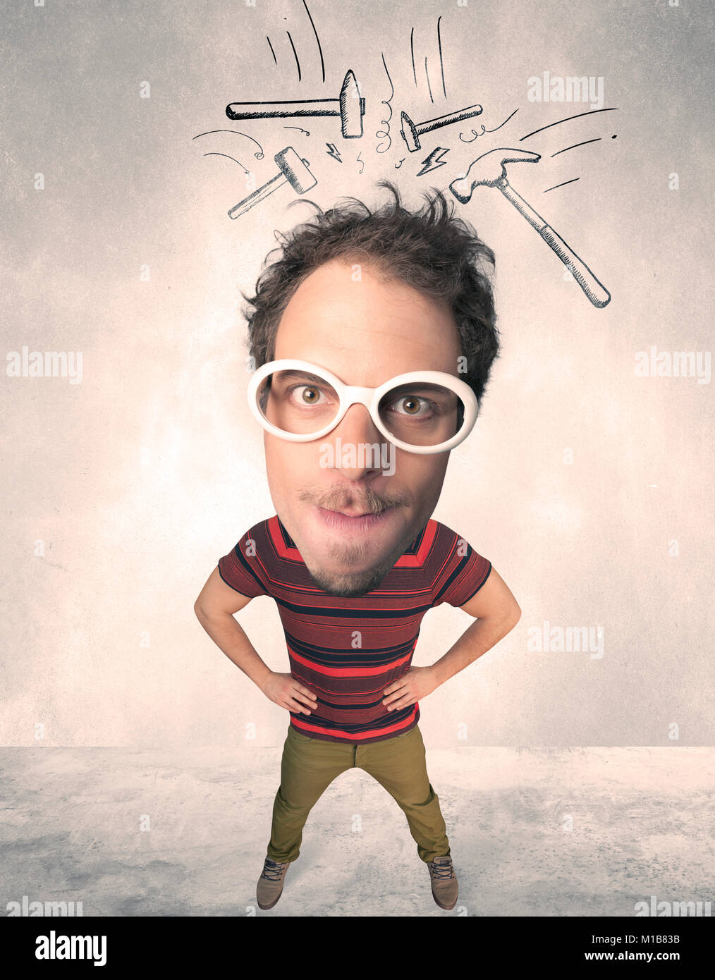 Funny person with big head and drawn punching hammers over it Stock ...