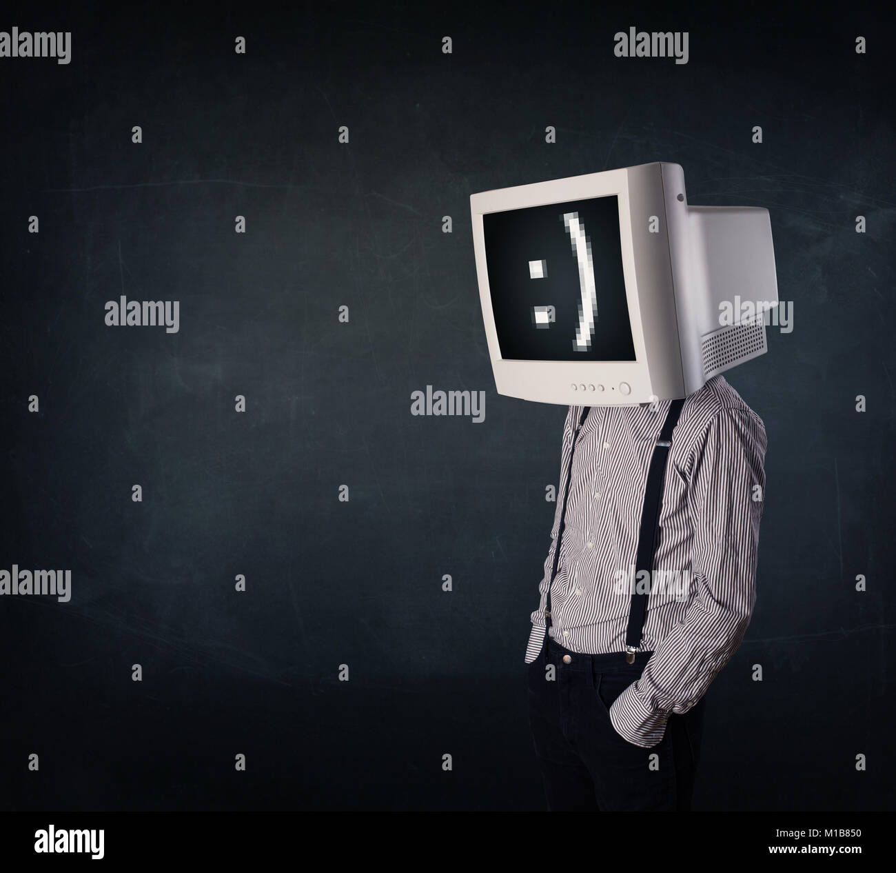 Funny young businessman with a monitor on his head and smiley on the ...