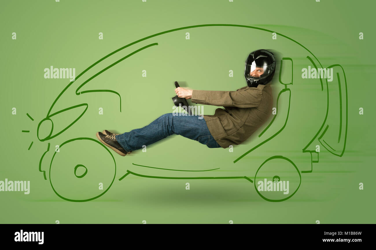 Man drives an eco friendy electric hand drawn car concept Stock Photo ...