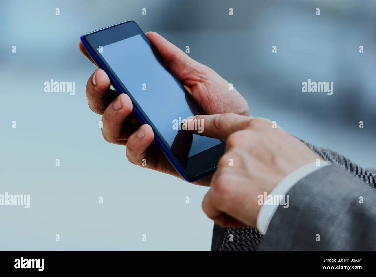Man use a mobile phone Stock Photo - Alamy