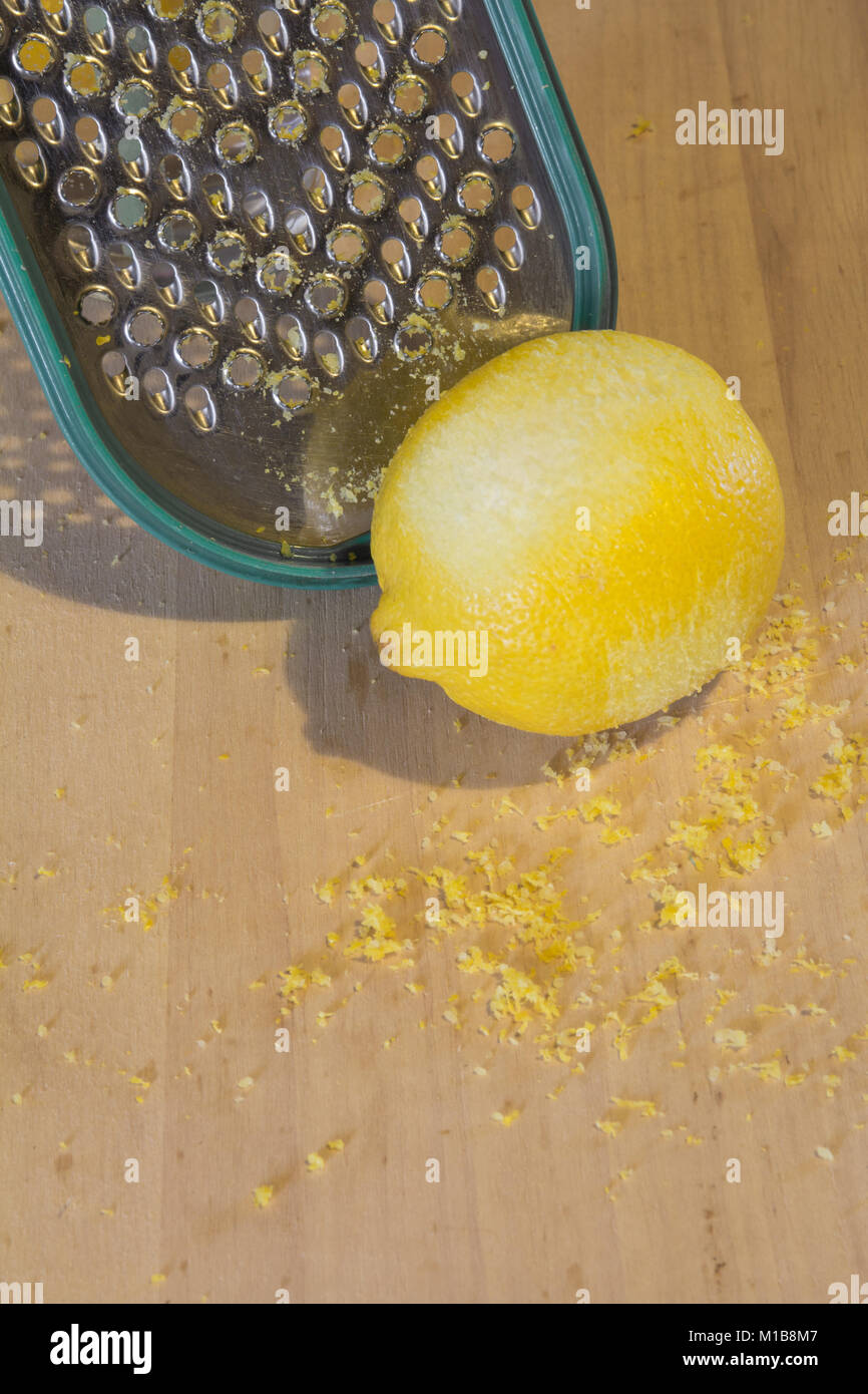 Grating a lemon Stock Photo - Alamy