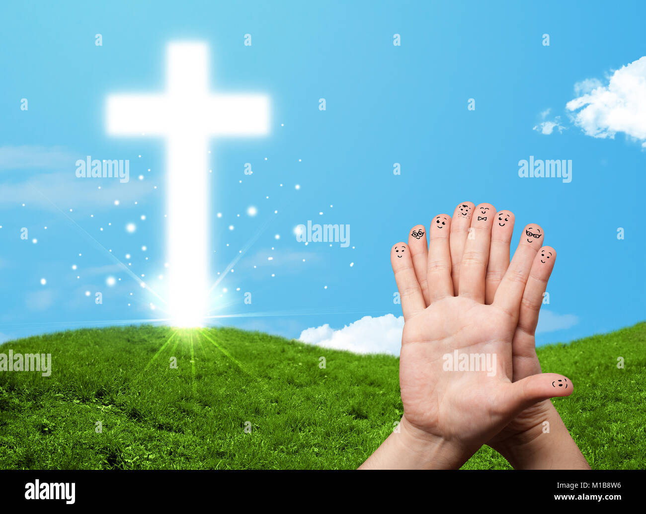 Happy finger smiley faces on hand with christian religion cross Stock ...