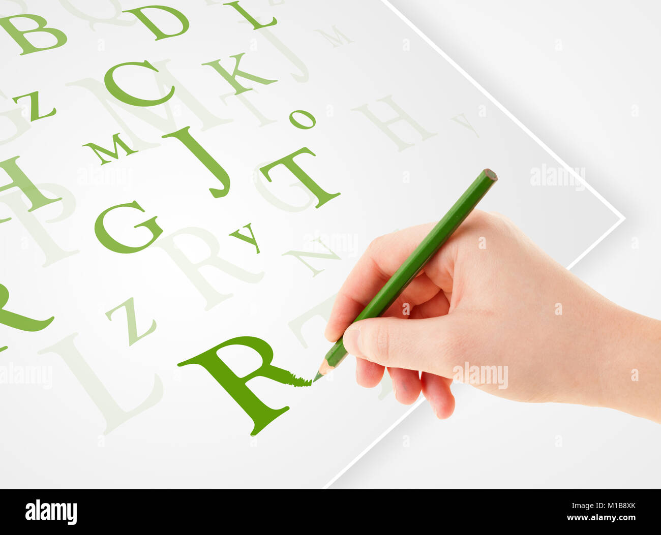 Human hand writing various letters on white plain paper Stock Photo - Alamy