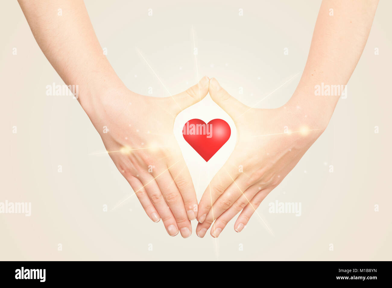 Hands creating a form with shining red heart in the center Stock Photo ...