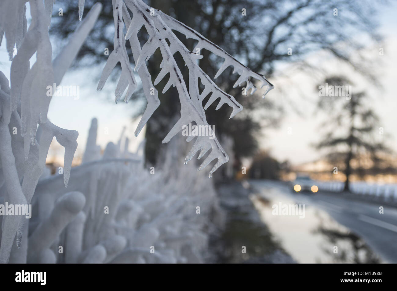 Cars driving through a puddle and sub zero temperatures create a ...