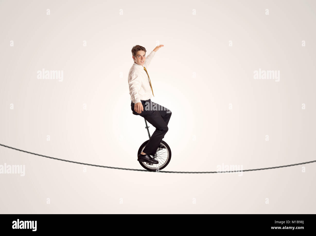 Man on unicycle juggling hi-res stock photography and images - Alamy