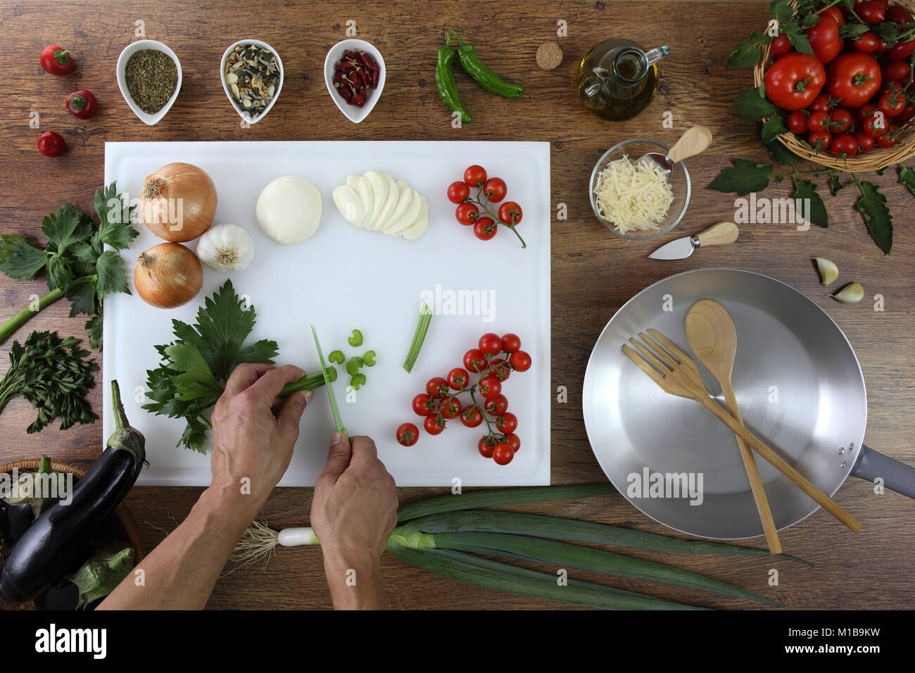 food top view, hands cutting on white chopping board in kitchen wooden ...