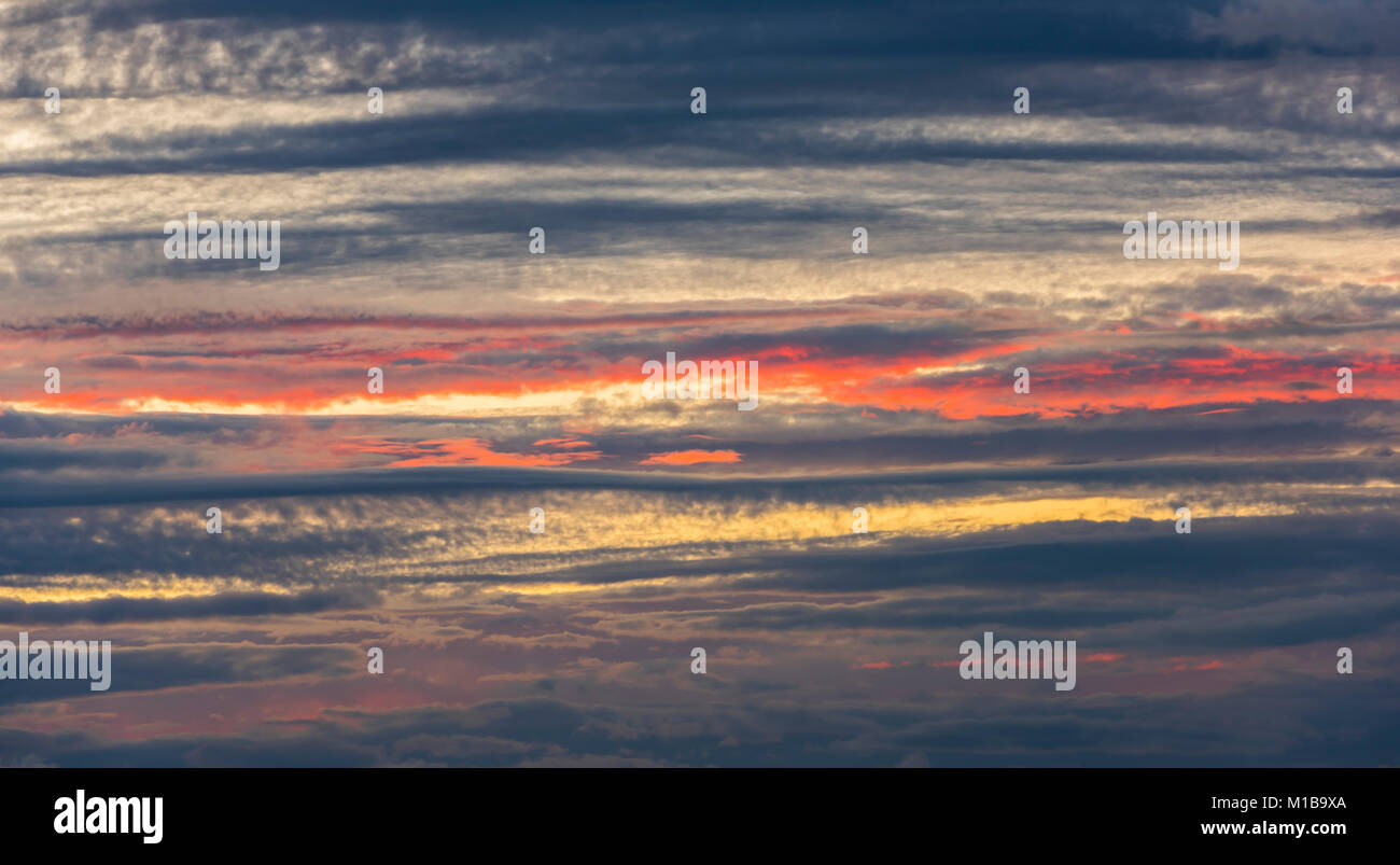 Red clouds in the sky with dark blue clouds during sunset Stock Photo ...