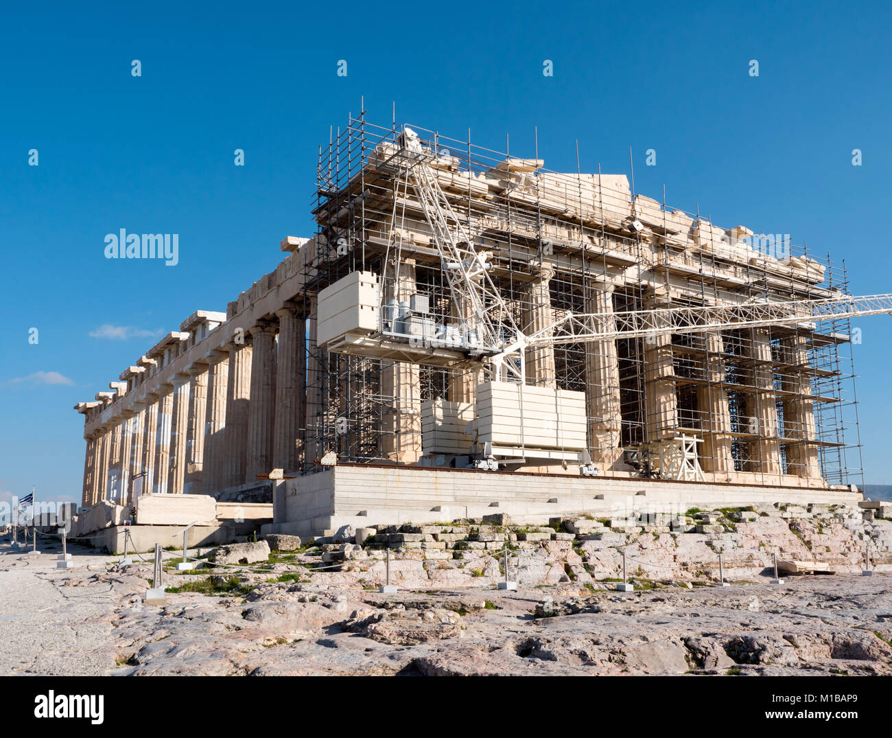 Part of Parthenon temple in Acropolis hill surrounded by scaffolding, Athens, Greece Stock Photo ...