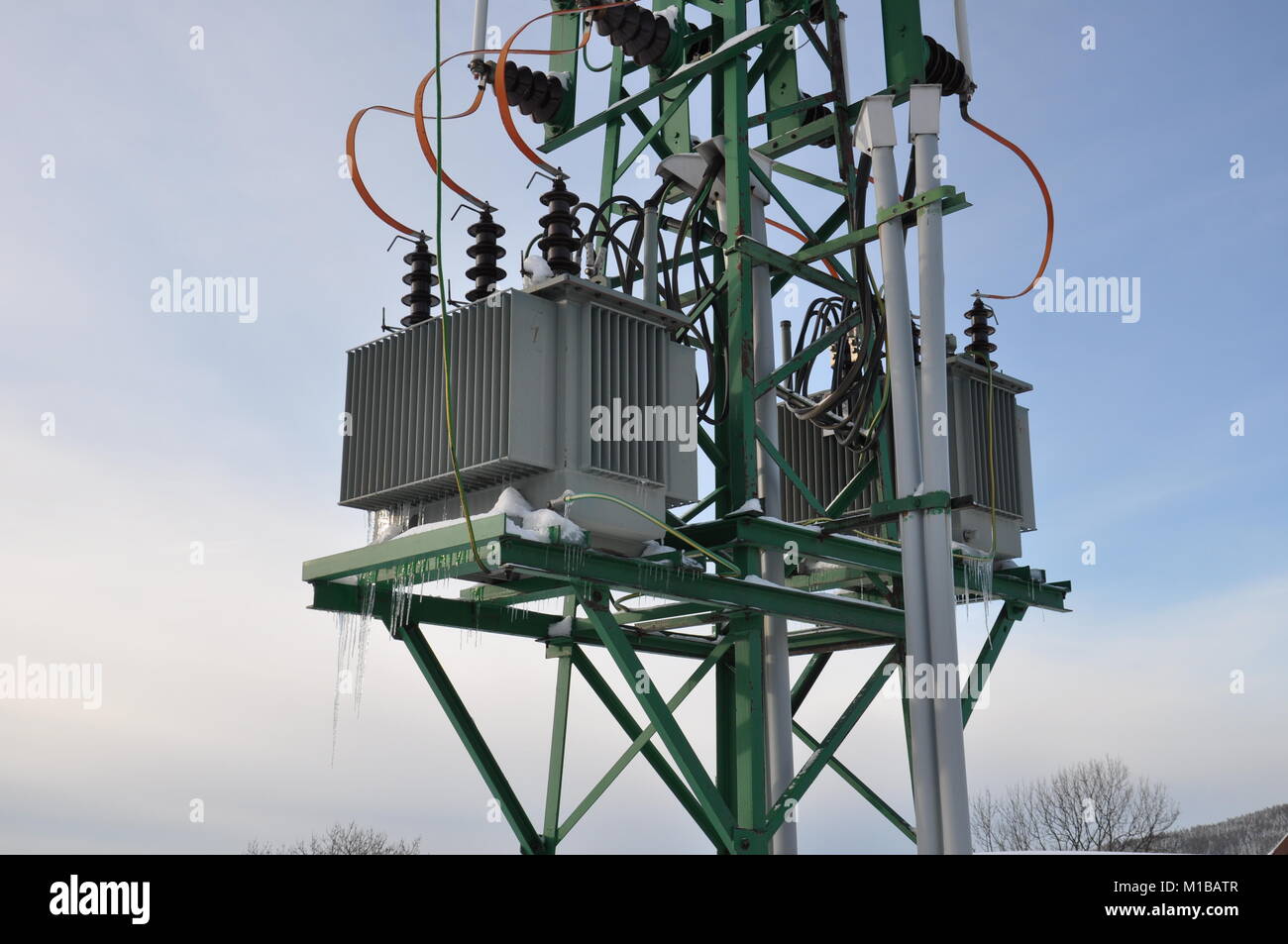 Mast with transformers, electricity, power, voltage, winter Stock Photo ...