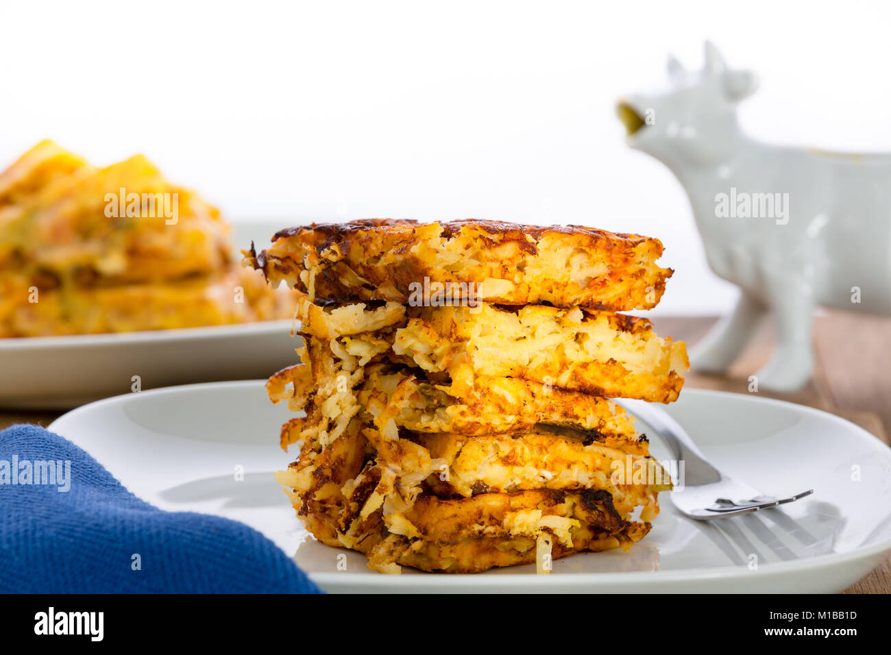 Stack of crispy waffle hash browns, or shredded potato pancakes, on a ...