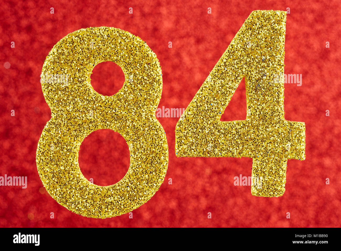 Number eighty-four yellow color over a red background. Anniversary ...