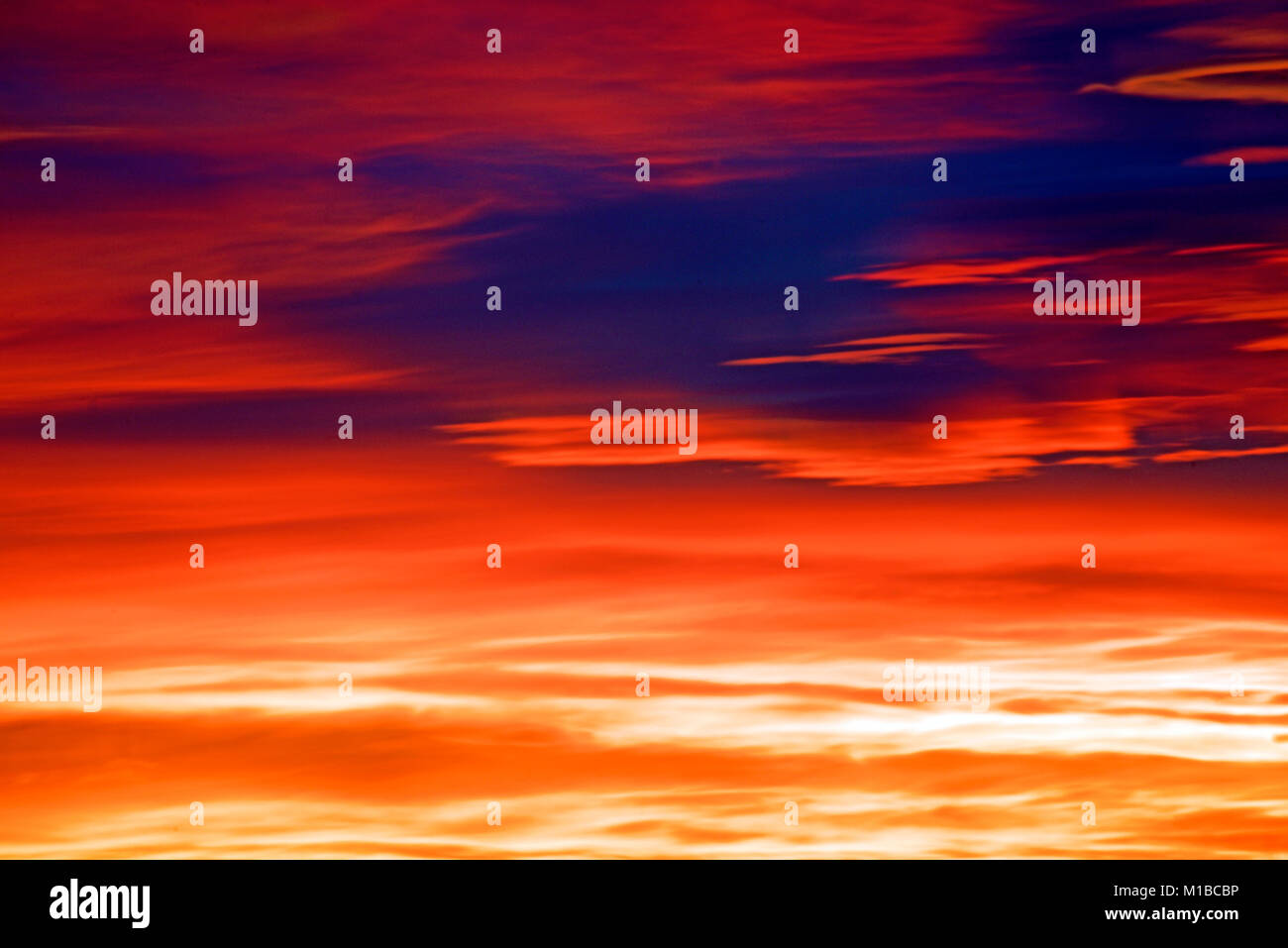 Beautiful vivid red orange sky during gorgeous sunrise Stock Photo - Alamy