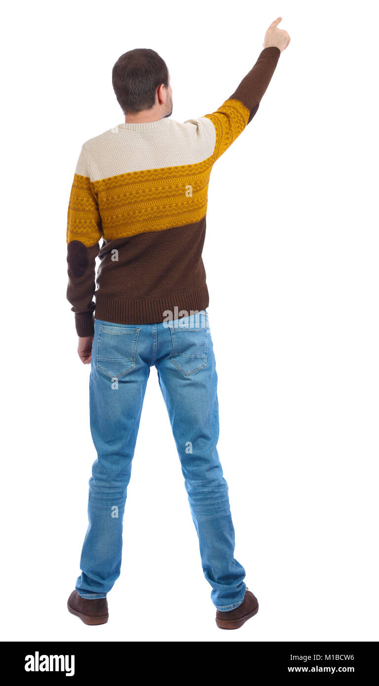 Back view of pointing young men in shirt and jeans. Young guy gesture ...