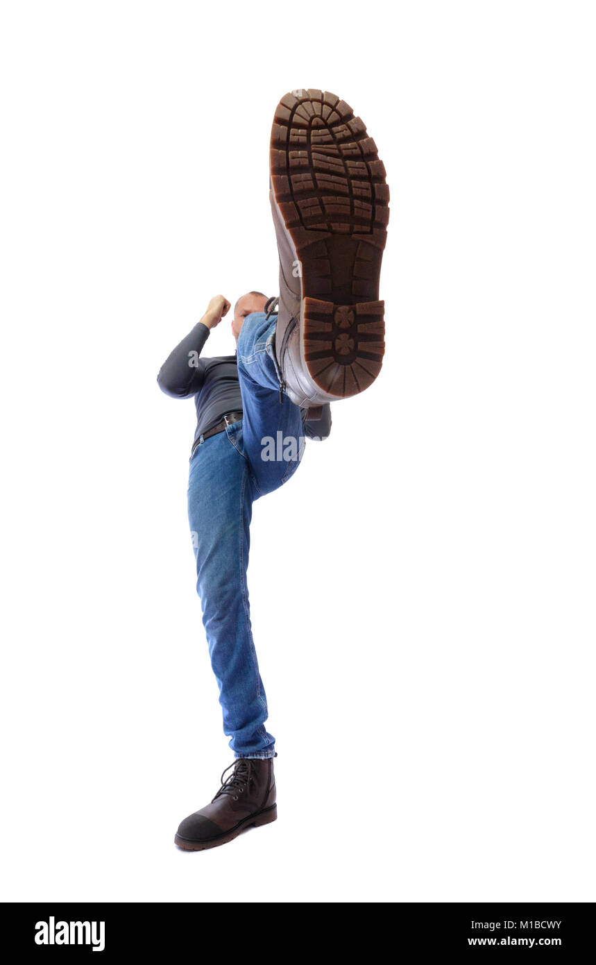 The man is kicking. Foot with a shoe close-up. A man pushing a ...