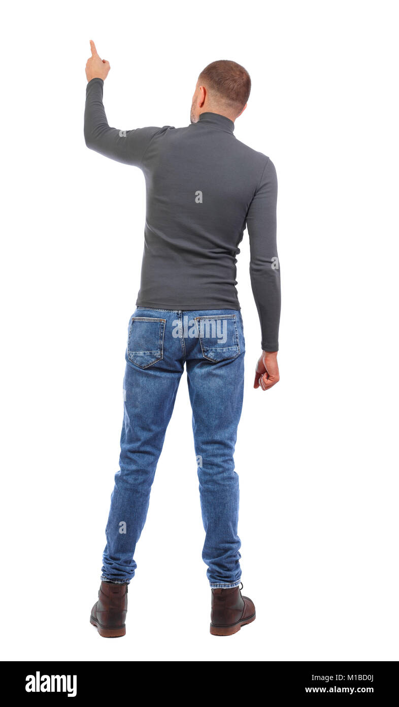 Back view of pointing young men in shirt and jeans. Young guy gesture ...