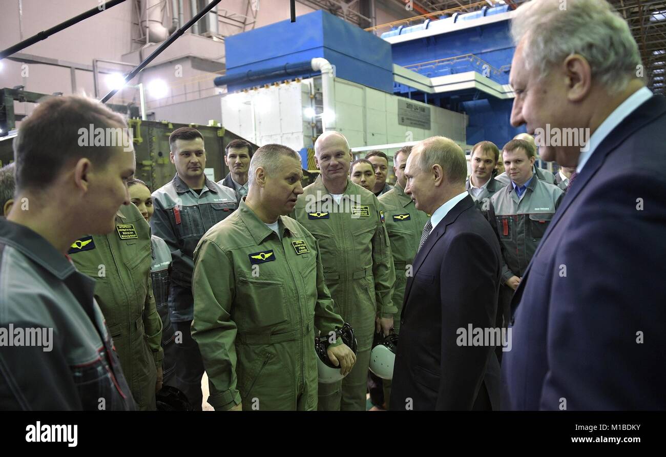 Russian President Vladimir Putin, center, speaks with test pilots ...