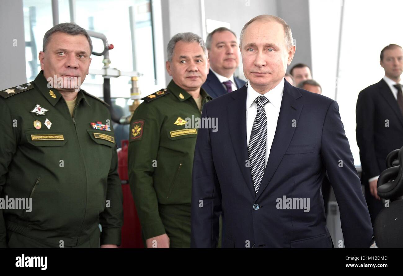 Russian President Vladimir Putin, right, during a tour of the Gorbunov ...