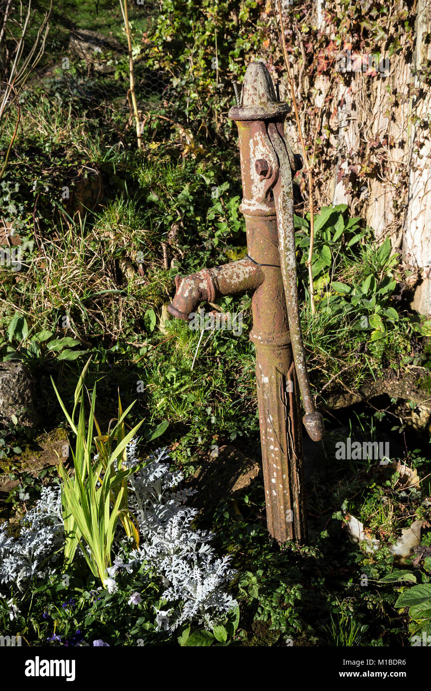 An old water pump,A pump for raising or moving water ,force, drive ...