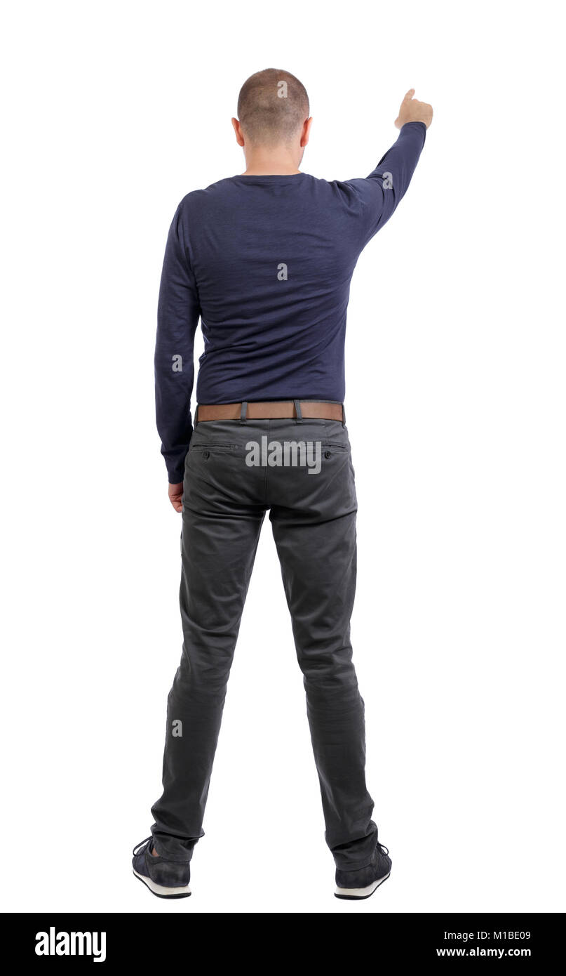 Back view of pointing young men in shirt and jeans. Young guy gesture ...