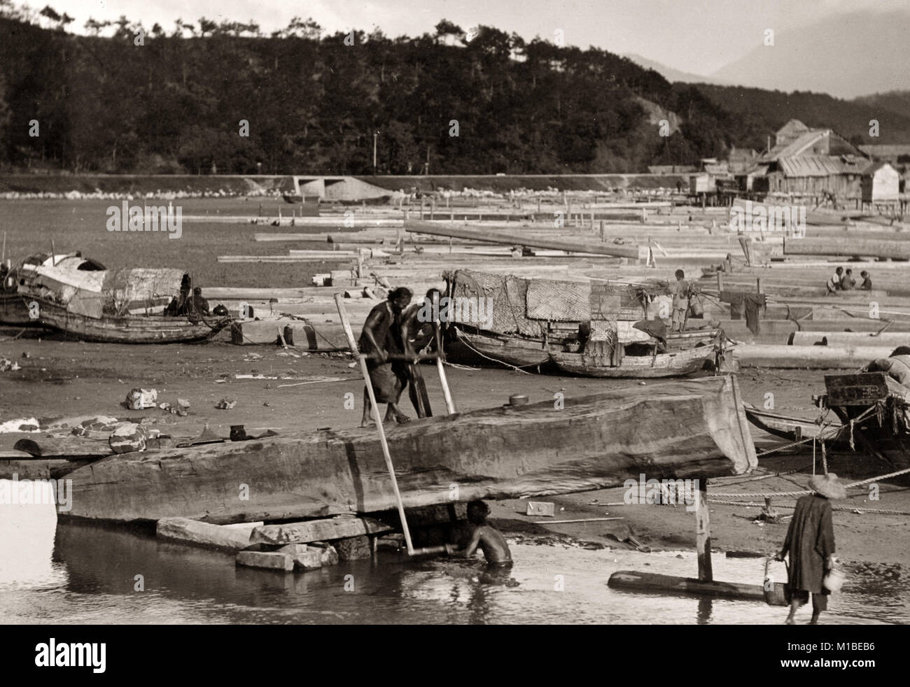 Boat builders in a shipyard, Hong Kong, c.1900 Stock Photo - Alamy