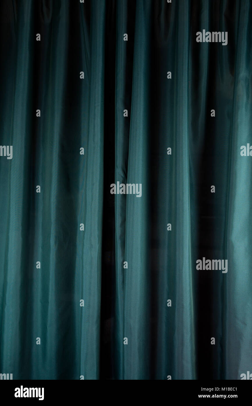 close-up view of a green cotton curtain. Minimal color still life ...