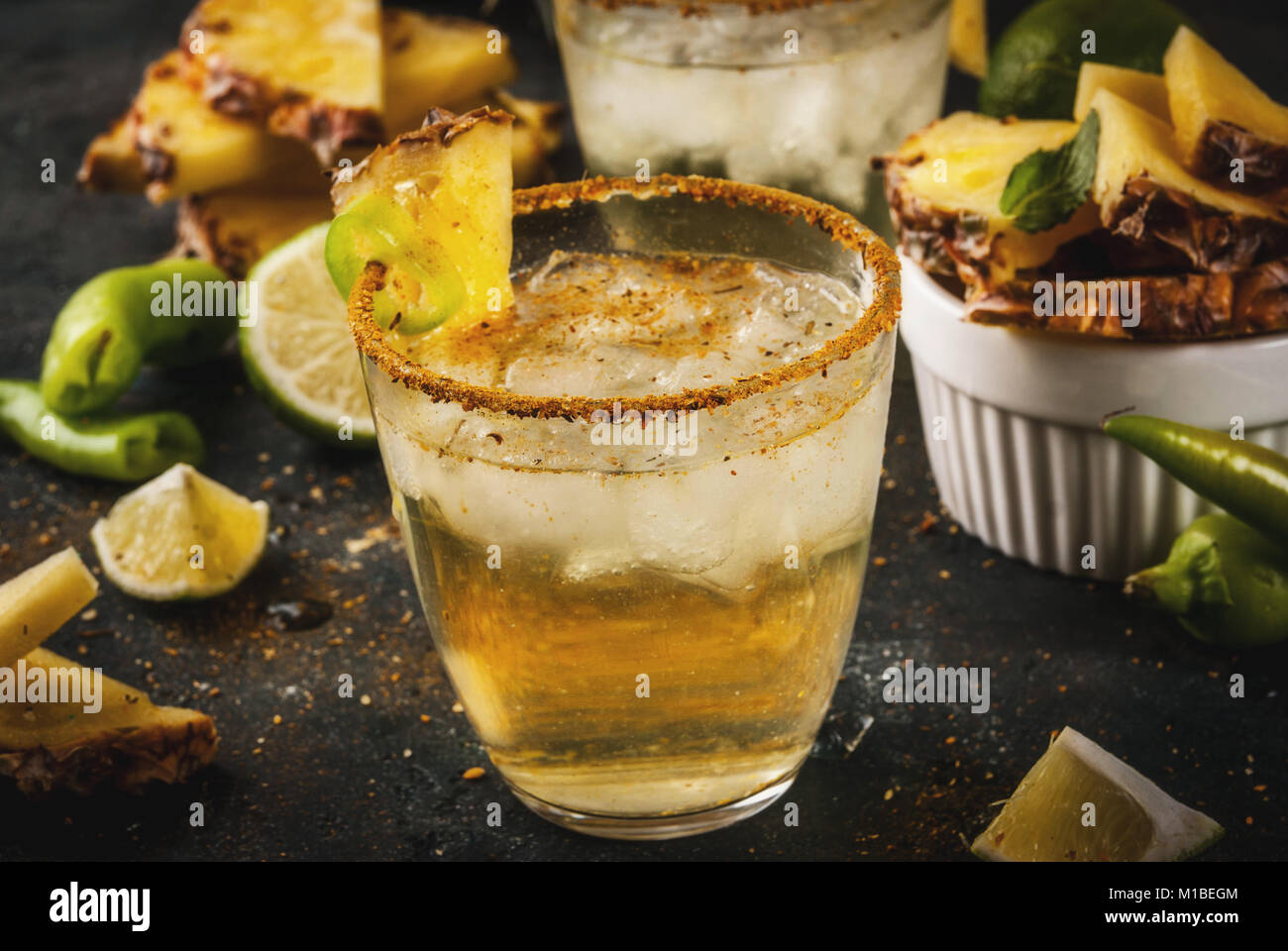 Mexican beverage, spicy margarita cocktail with pineapple and jalapeno ...