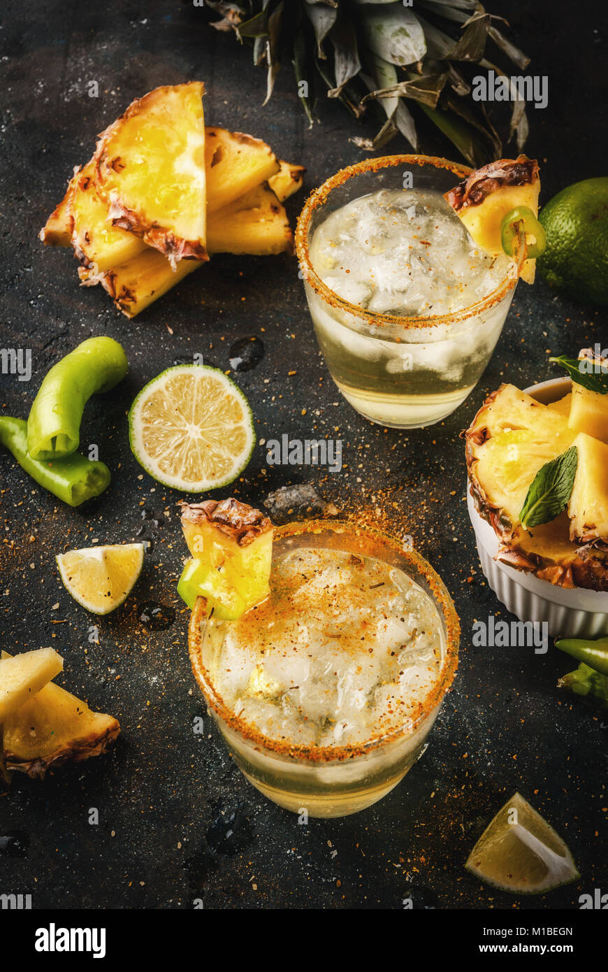 Mexican beverage, spicy margarita cocktail with pineapple and jalapeno ...