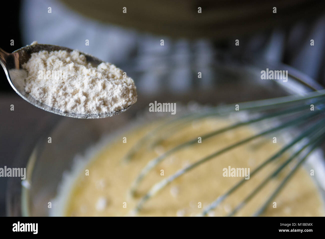 Preparing dough and recipe ingredients including eggs, flour, milk ...