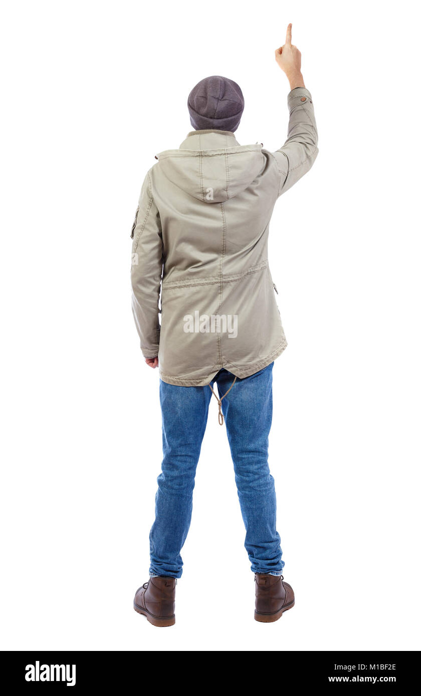 Back view of pointing young men in shirt and jeans. Young guy gesture ...