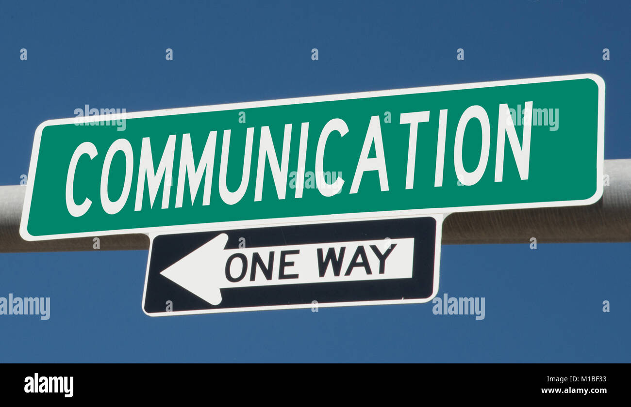 Communication One Way green highway sign Stock Photo - Alamy