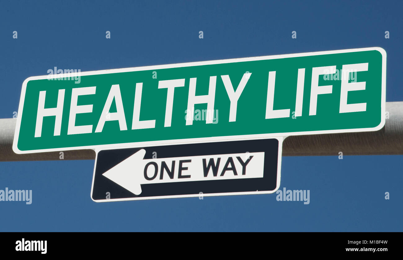 Healthy Life One Way green highway sign Stock Photo - Alamy
