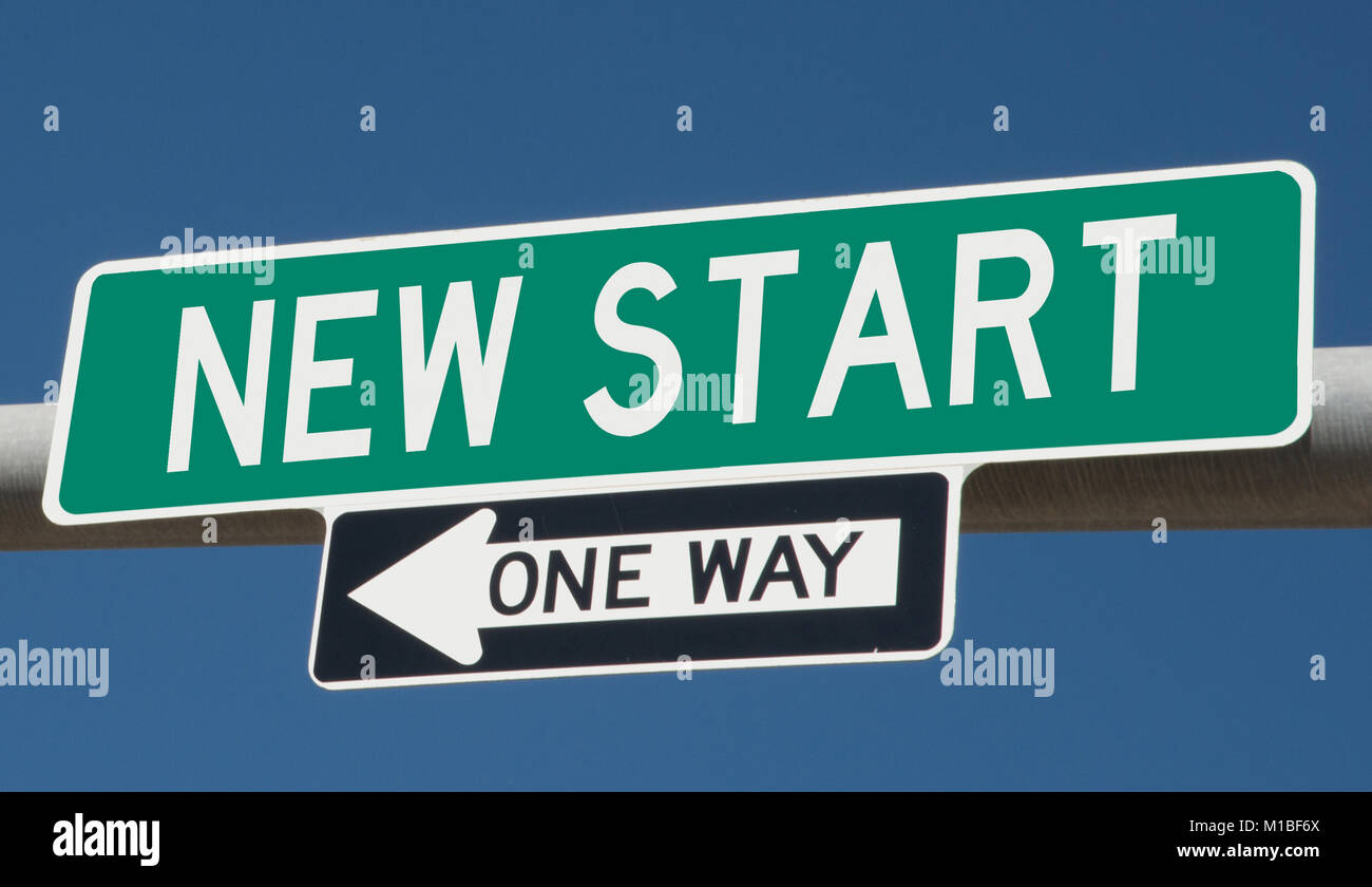 New Start One Way green highway sign Stock Photo - Alamy