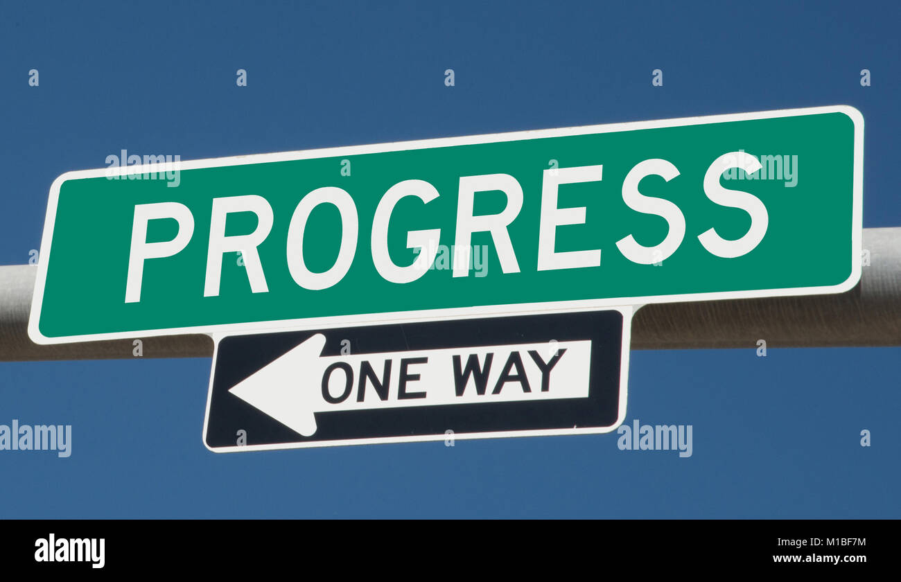 Progress One Way green highway sign Stock Photo - Alamy