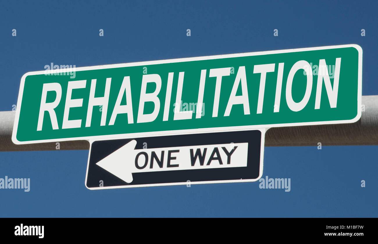 Rehabilitation One Way green highway sign Stock Photo - Alamy