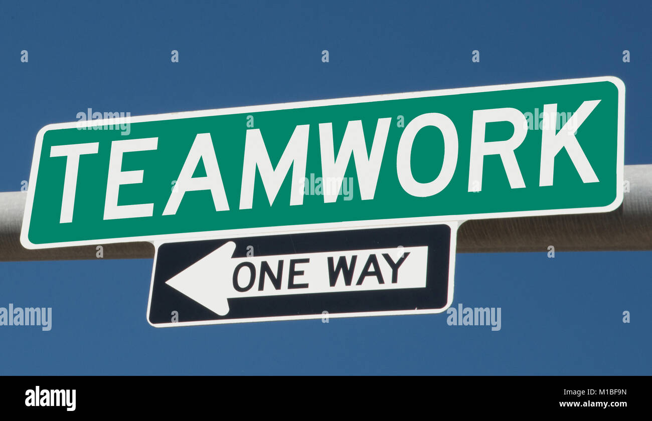 Teamwork one way sign Stock Photo - Alamy