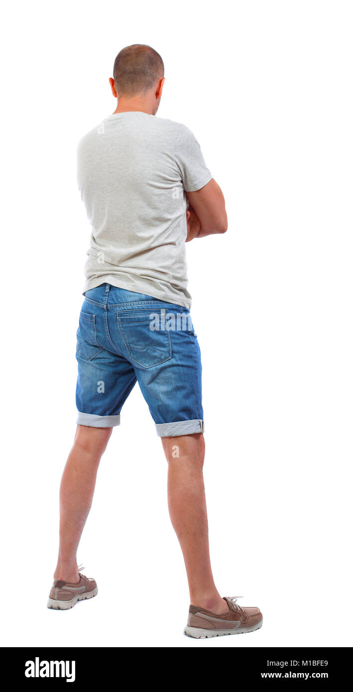 Back view of man in jeans. Standing young guy. Rear view people ...