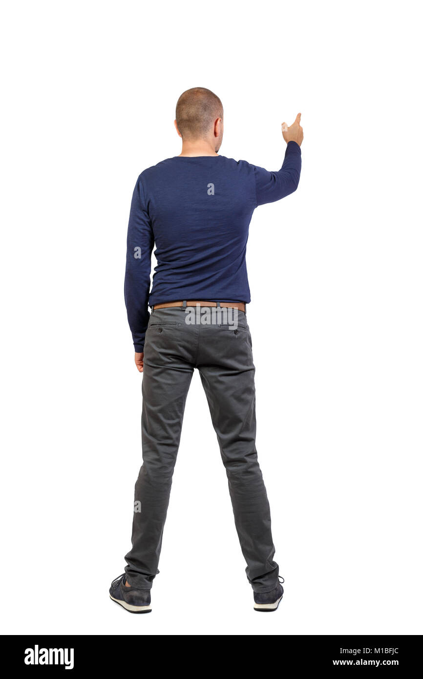 Back view of pointing young men in shirt and jeans. Young guy gesture ...
