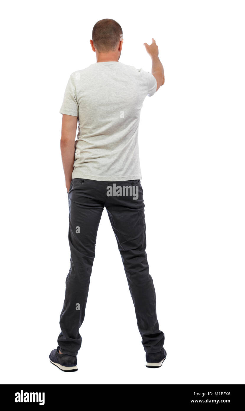 Back view of pointing young men in shirt and jeans. Young guy gesture ...
