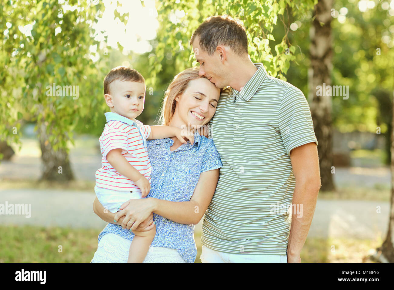 Happy family in nature Stock Photo - Alamy