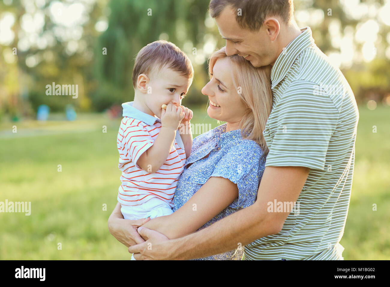 Happy family in nature Stock Photo - Alamy