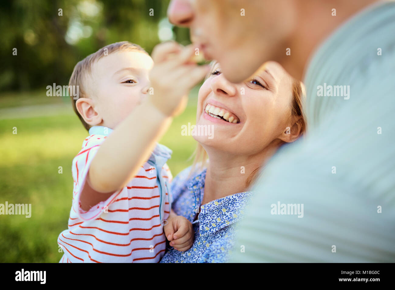 Happy family in nature Stock Photo - Alamy