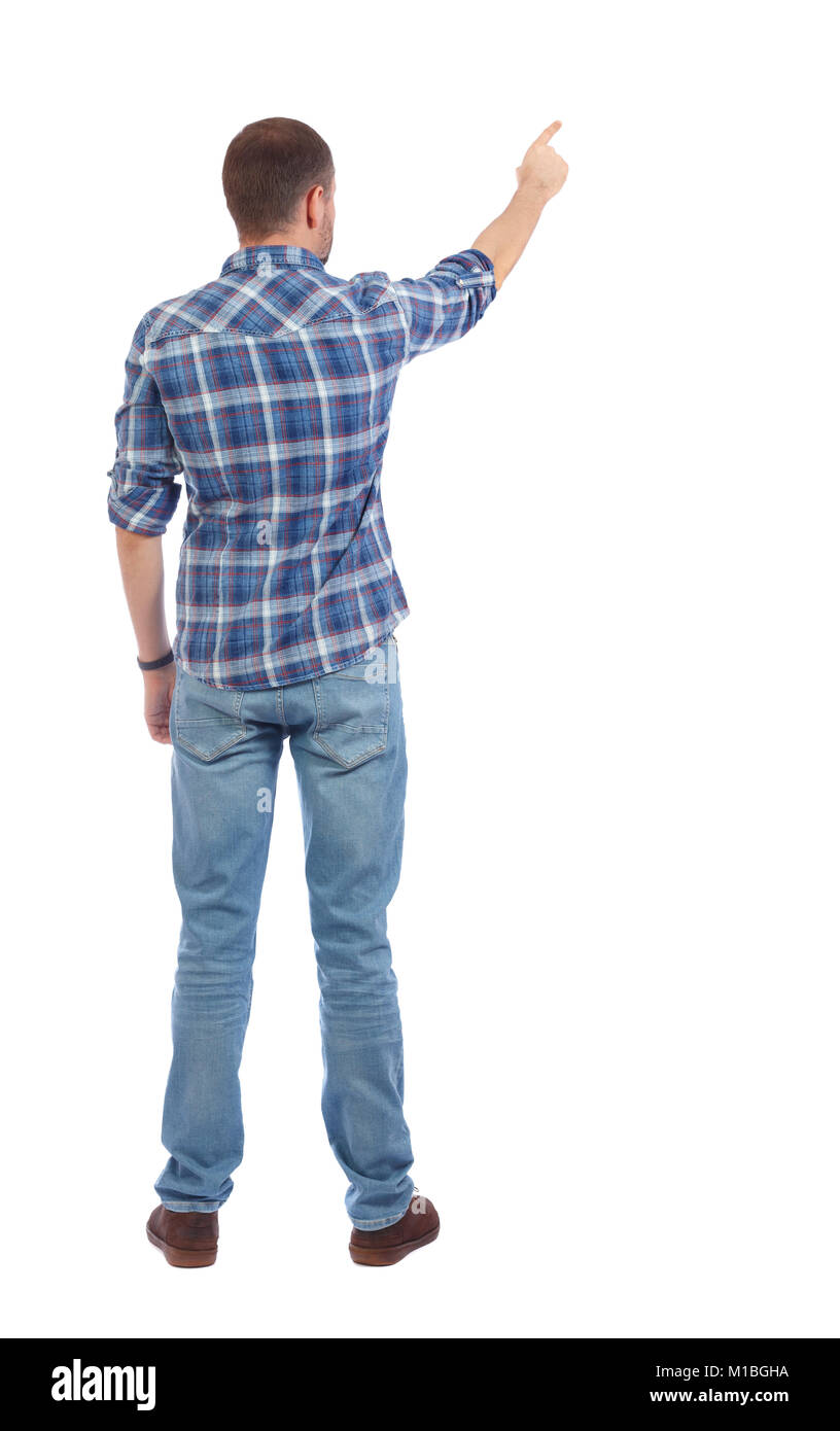 Back view of pointing young men in shirt and jeans. Young guy gesture ...