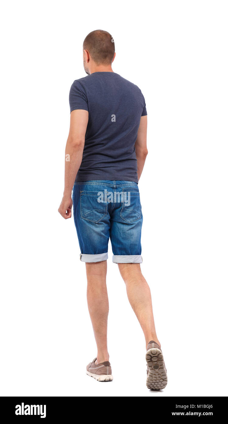 Back view of going handsome man. walking young guy . Rear view people ...