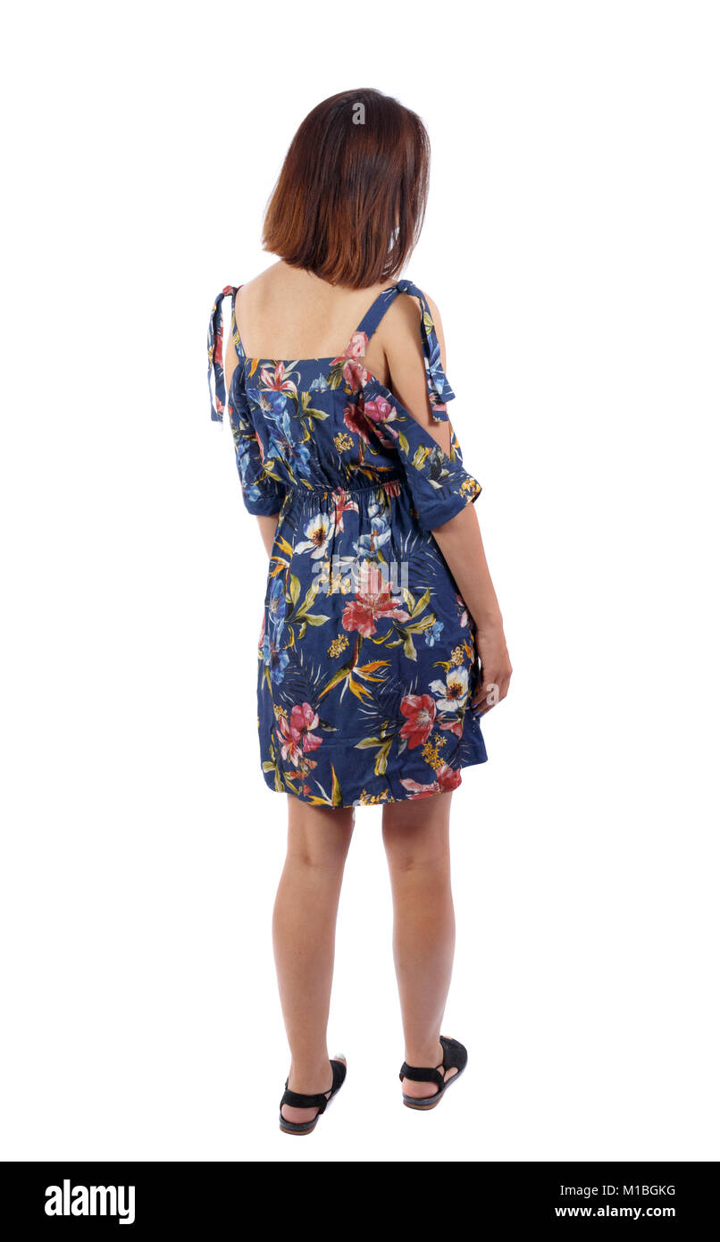 back view of standing young beautiful woman. girl watching. Rear view ...